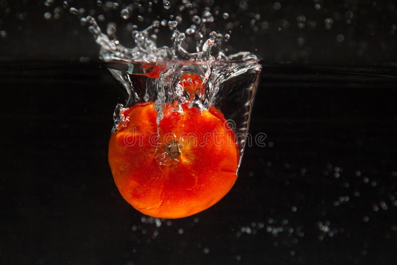 Red Tomato Falling Down in Glass with Water Stock Image - Image of ...
