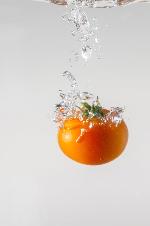 Tomato Falling into the Water Stock Photo - Image of transparent ...