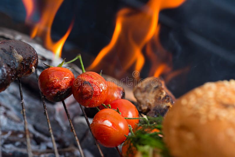 Tomato on Flaming BBQ Grill Stock Photo - Image of appetizer, meat ...