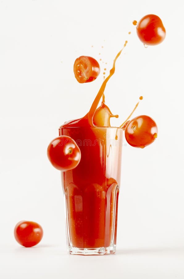 Tomato Juice Splash with Flying Tomato Cherry Stock Photo - Image of ...