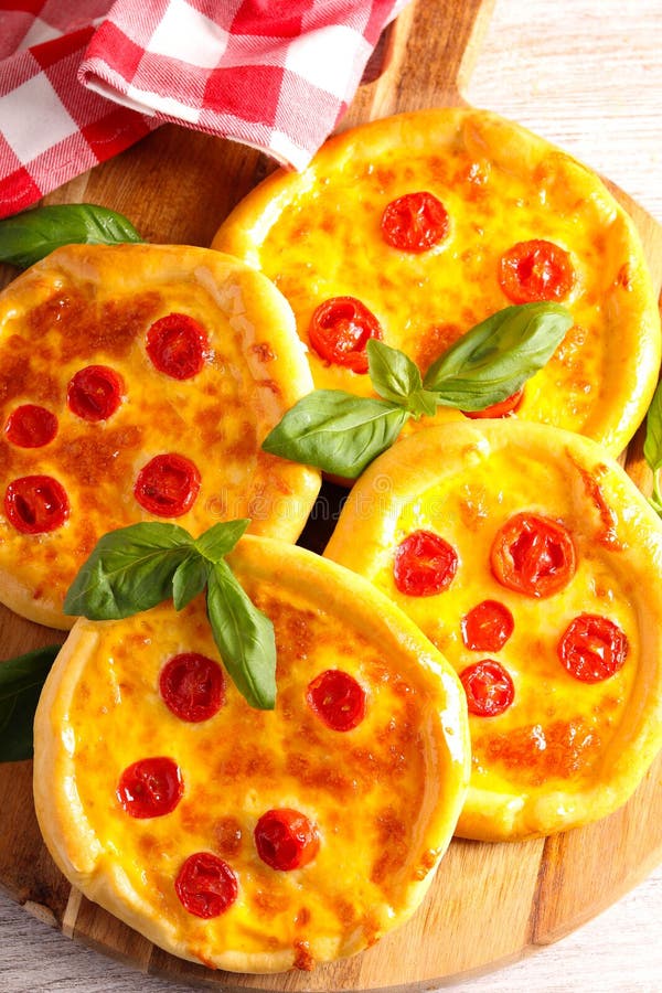 Tomato and Mozzarella Mini Pizzas Stock Photo - Image of bake, copy ...