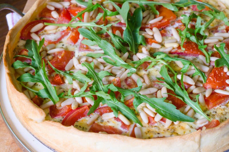 Tomato and ruccola quiche stock image. Image of eating - 47070735
