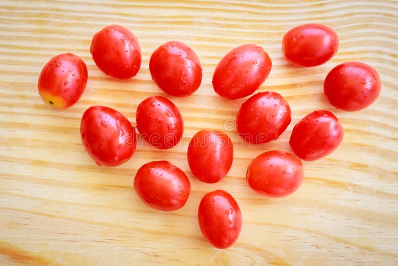 Tomato in Shape Heart on Wood Plate Stock Photo - Image of tomato, cook ...