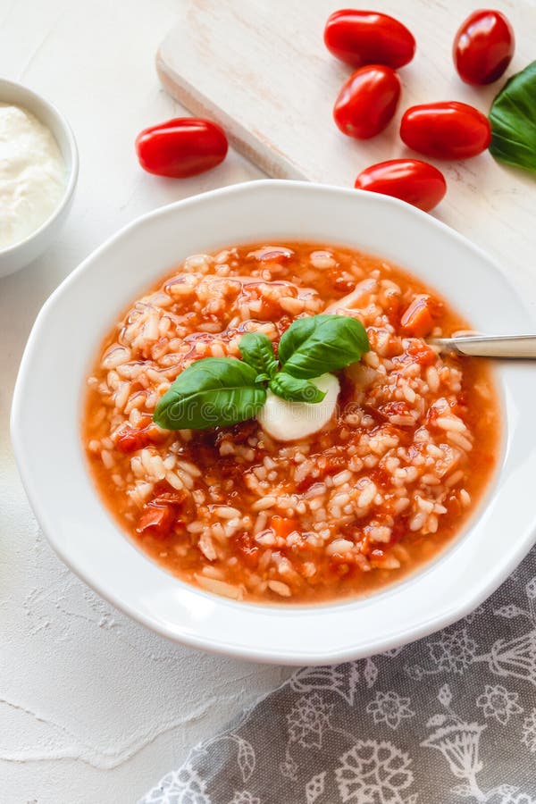 Tomato soup with rice stock photo. Image of dinner, background - 216529304