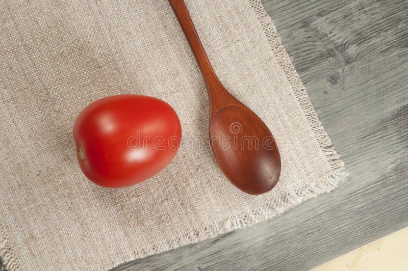 Tomato and a spoon stock image. Image of harvest, vegetarian - 35225959