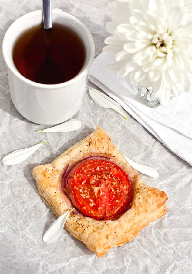 Tomato tart and cup of tea stock image. Image of puff - 35724547