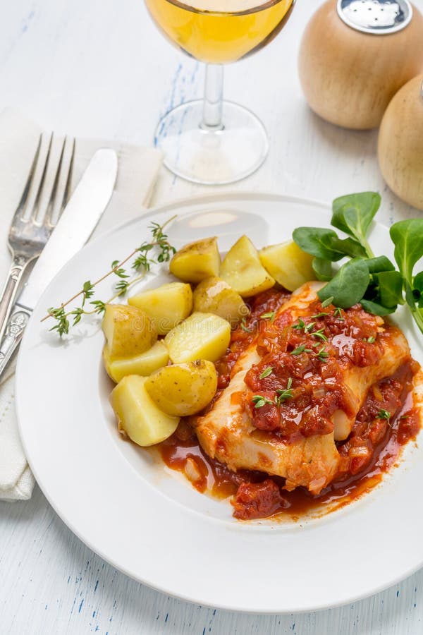 Cod or Pollack Cooked in Tomato and Thyme Sauce Stock Image - Image of ...