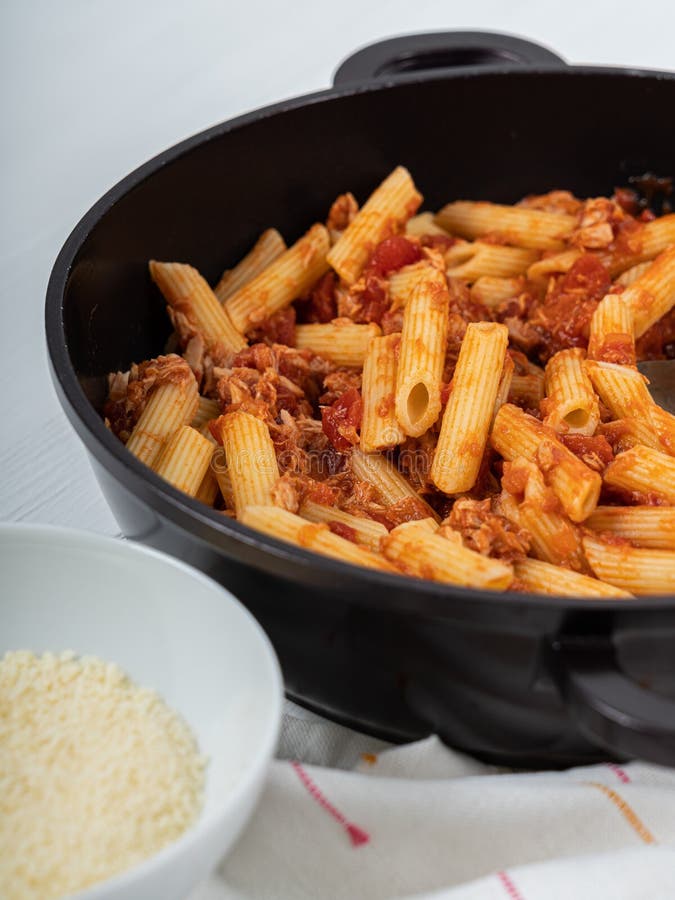 Tomato and Tuna Fish Pasta with Parmesan Stock Photo - Image of herb ...