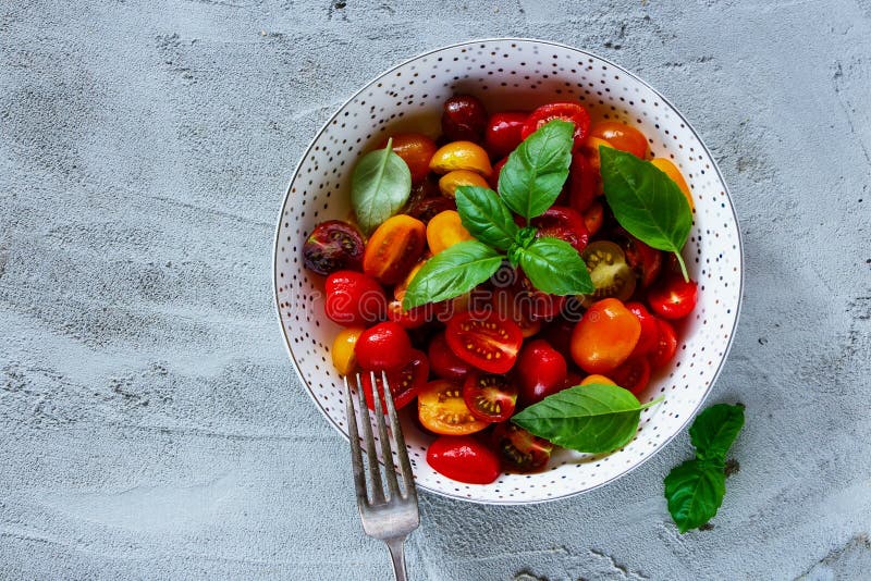 Tomatoes with basil stock image. Image of garnish, meal - 74289455