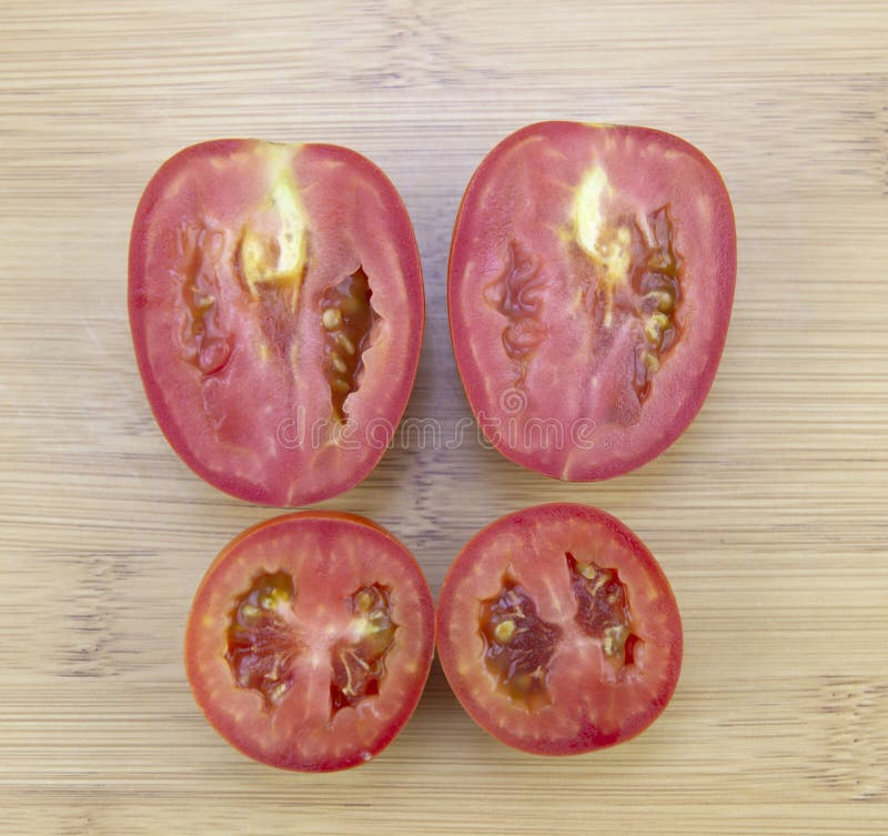 Tomatoes Cut in Half Laying on Wooden Floor Stock Image - Image of ...