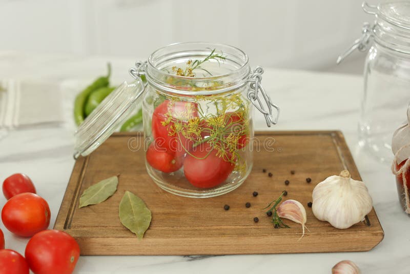Tomatoes and Dill in Pickling Jar on Kitchen Table Stock Photo - Image ...