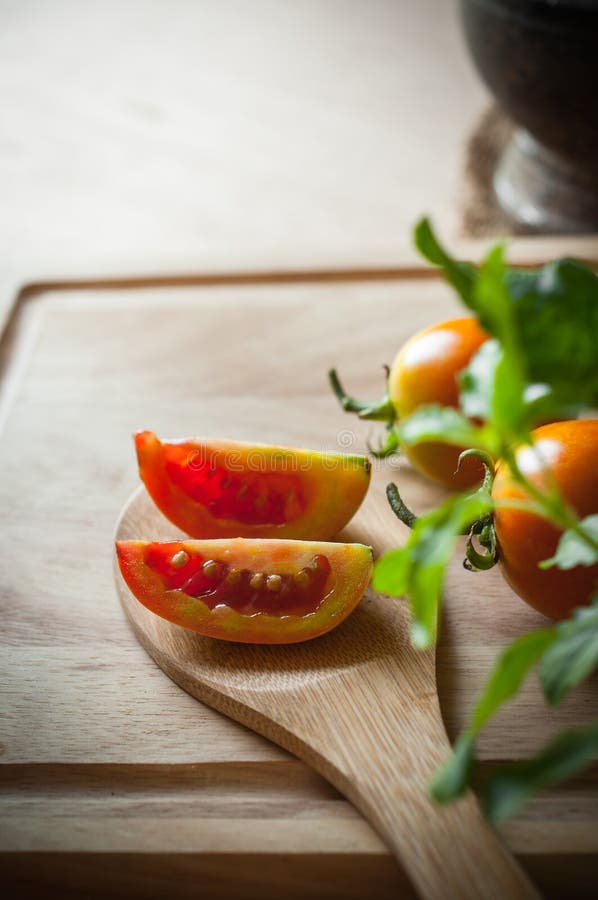 Tomatoes Slice on Wood Ladle Stock Photo - Image of biology, holy: 36596572