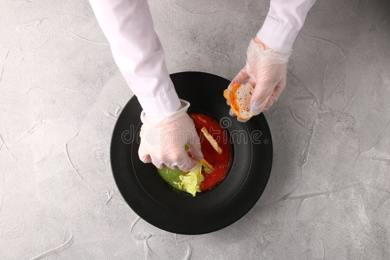 Tomatoes Soup with Hands. Chef Decorating Plate. Kitchen Processing ...
