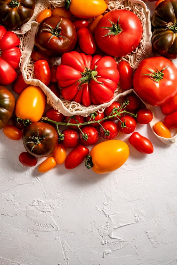 Tomatoes on the Table. Tomatoes of Different Varieties Stock Image ...