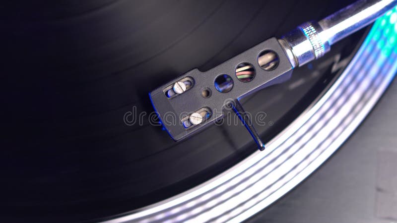 Tonearm Headshell with Needle on Spinning Vinyl Record and DJ Turntable ...