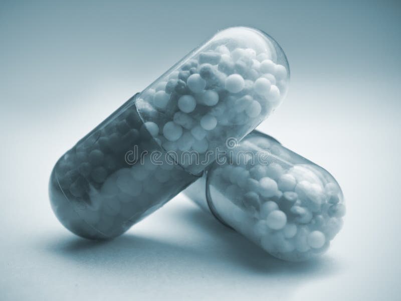 Three Blue Capsules Over White Stock Photos - Free & Royalty-Free Stock ...