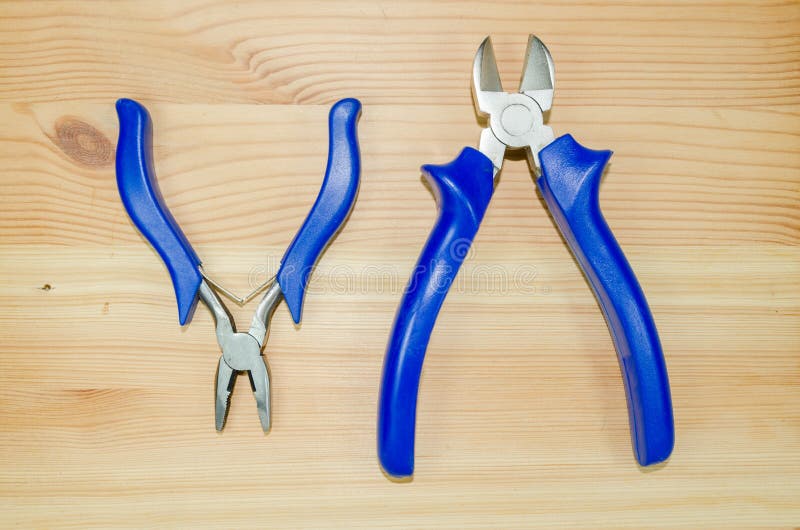 A Tongs and Pliers Tools on a Wooden Board Stock Image - Image of ...
