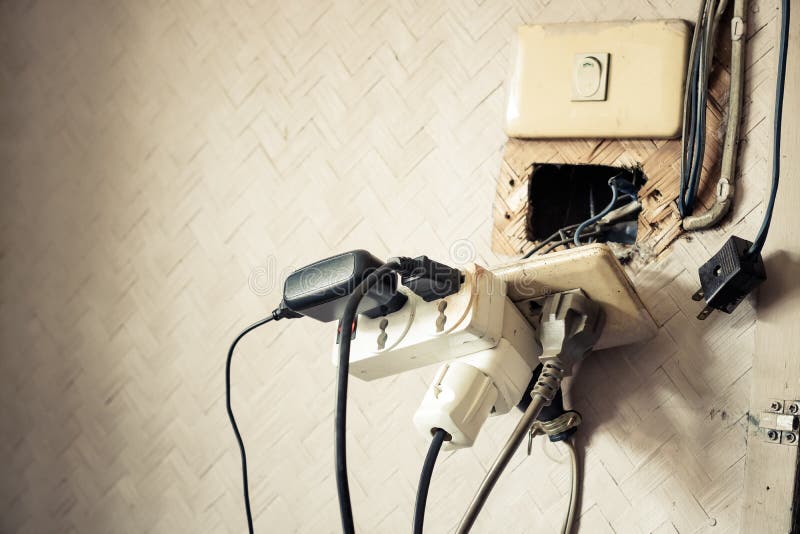 Too many plugs in a socket stock image. Image of poor - 111980771