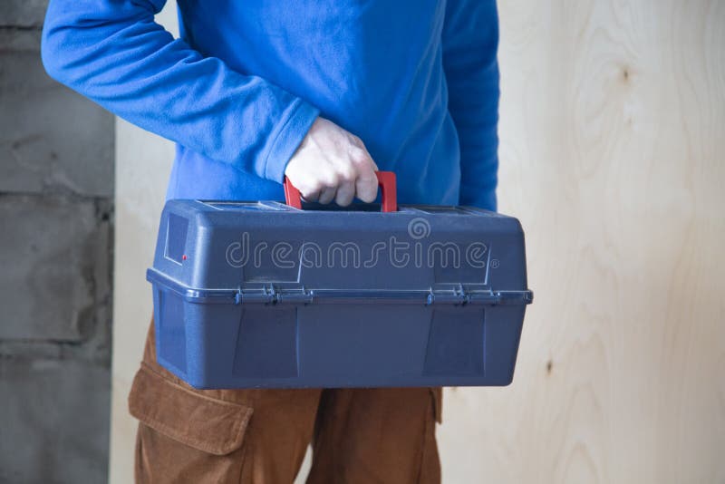 A Tool Box in the Hands of a Working Man. a Working Tool Stock Photo ...