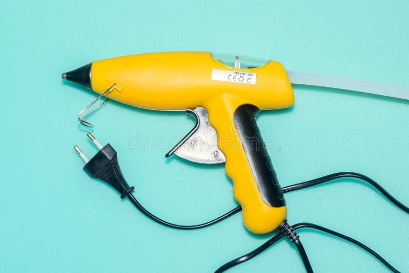Electric Glue Gun on a Blue Background Stock Photo - Image of fixing ...