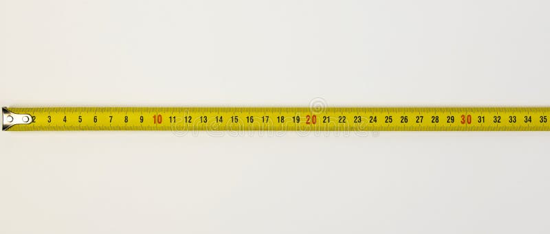 A Tool for Measuring Length. Construction Measuring Tape on a White ...