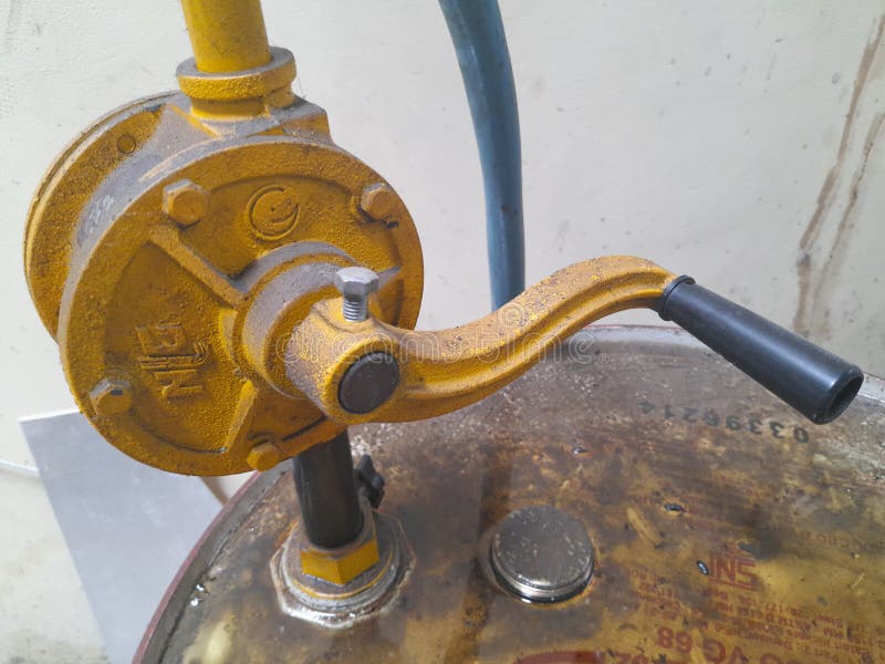 A Tool Used To Pump Oil from Inside a Drum in an Industrial Environment ...