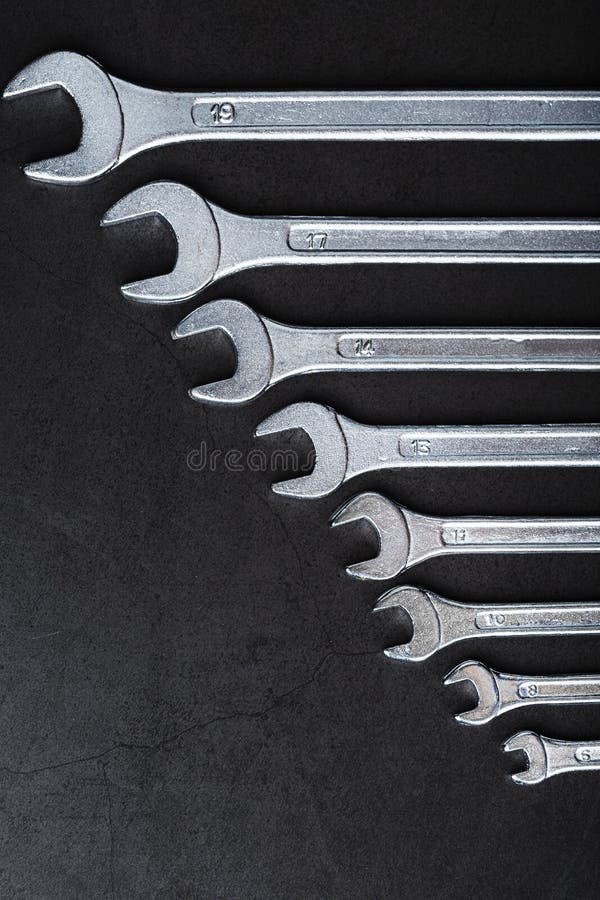 Tool Wrenches in a Row on a Black Background with Free Space. Stock ...