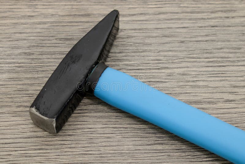 Tools, a Blue and Black Hammer on a Decorated Wood Table Stock Photo ...