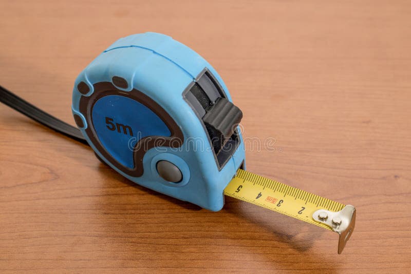 Tools, Blue Measuring Tabe on a Wood Table Stock Image - Image of mark ...