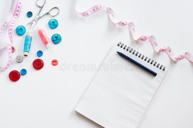 Sewing Materials - a Box with Threads of Bright Colors, a Pink Ribbon ...