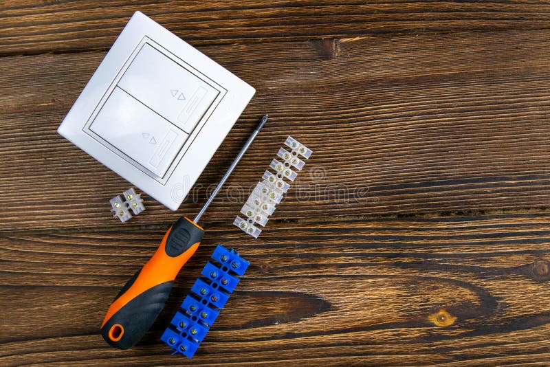 Tools of an Electrician Installer or Builder on a Dark Wooden Table ...