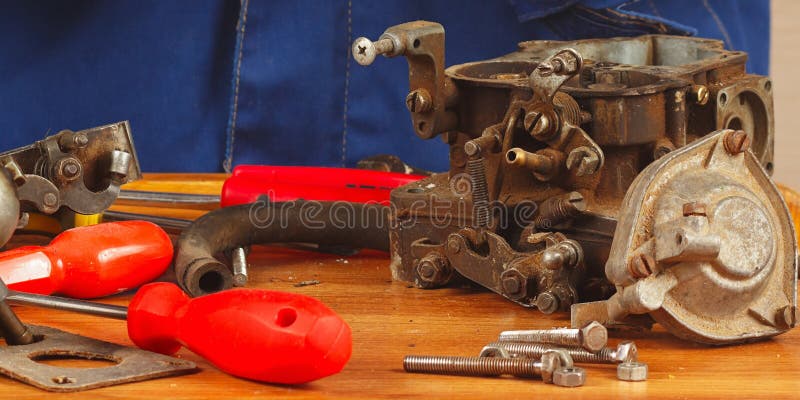 Tools and Engine Parts in the Workplace Automotive Serviceman Stock ...