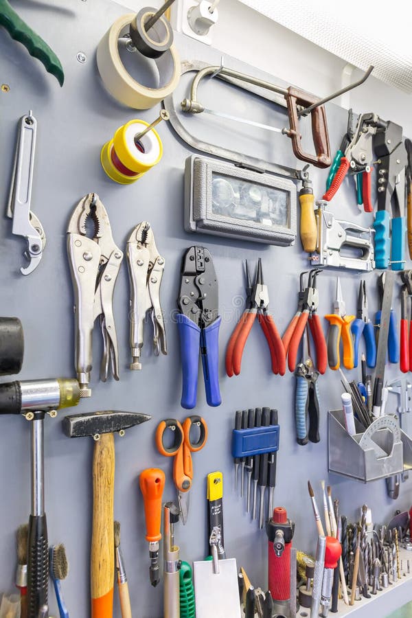 Tools on garage wall stock image. Image of pliers, wooden - 51136511