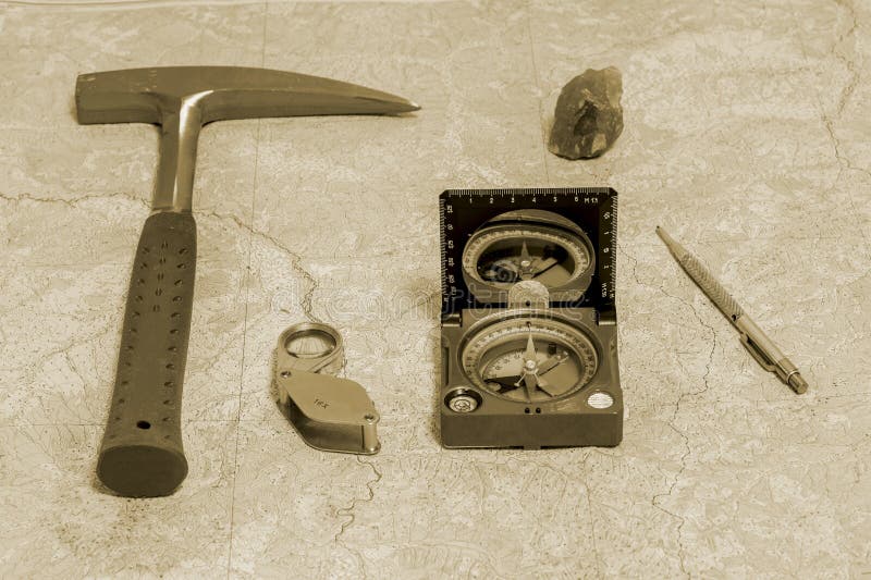 The Tools of the Geologist Laid Out on a Topographic Map. Background ...