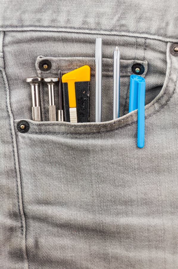 Tools in grey jean pocket stock image. Image of jeans - 39882113