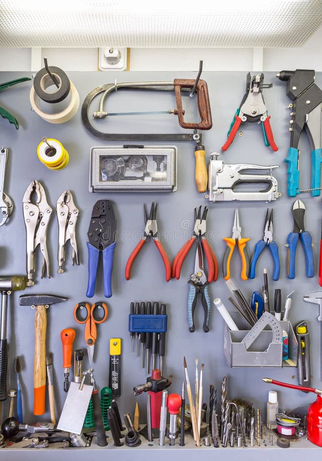 Tools hanging on the wall stock photo. Image of group - 51135608