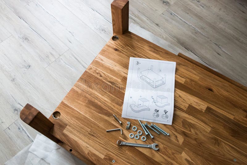 Tools and Instructions for Assembling a Wooden Table Stock Photo ...