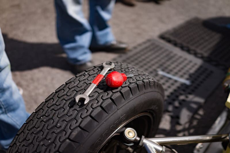 Tools Lie on Top of a Racing Car Wheel Stock Image - Image of jeans ...