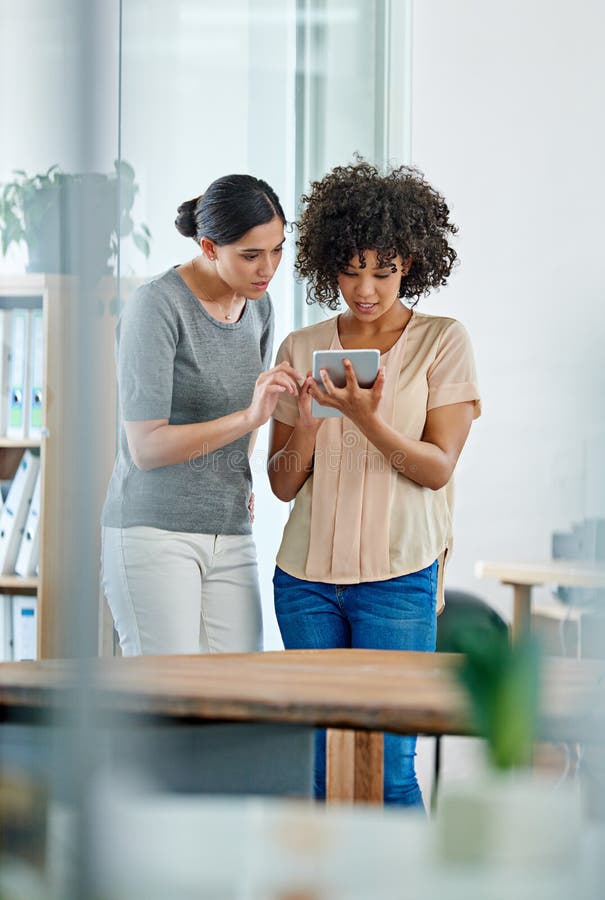 Tools for the Modern Professional. Two Office Colleagues Having a ...