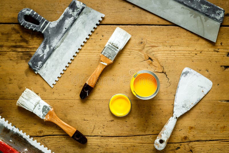 Tools for Painting on a Wooden Table with Yellow Paint Stock Image ...
