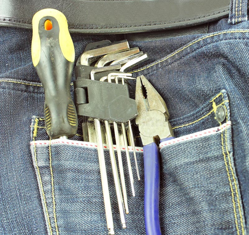 Tools on a pants pocket stock photo. Image of builder - 35195992