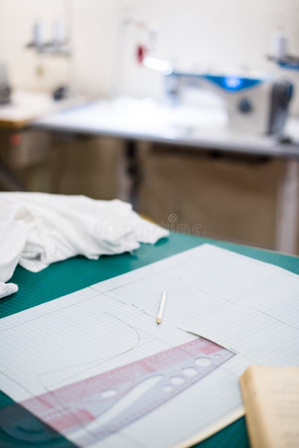 Tools, Patterns and Fabric Samples on the Sewing Table in the Tailor ...