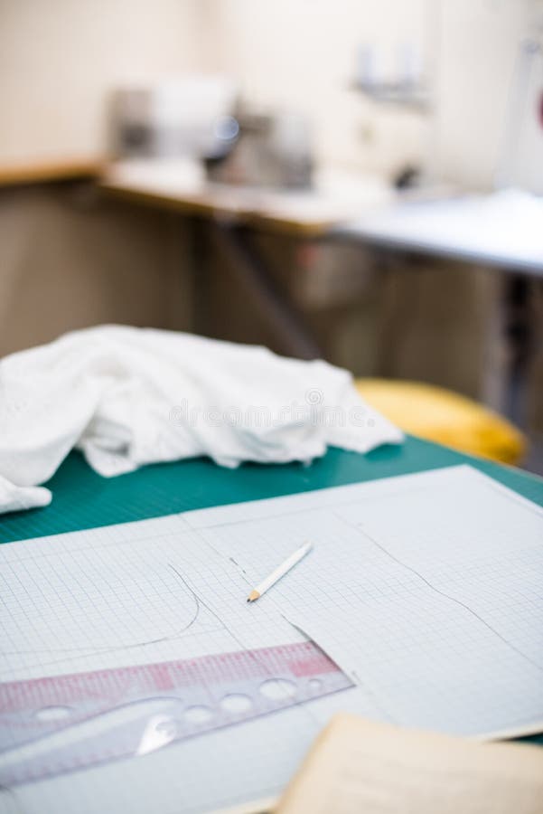Tools, Patterns and Fabric Samples on the Sewing Table in the Tailor ...
