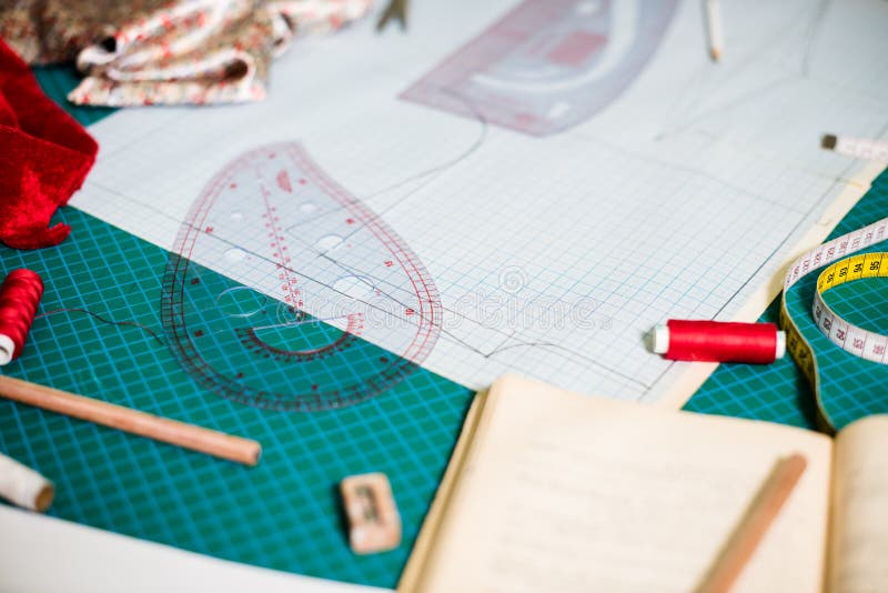 Tools, Patterns and Fabric Samples on the Sewing Table in the Tailor ...