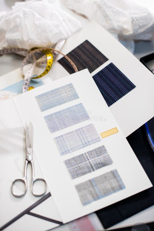 Tools, Patterns and Fabric Samples on the Sewing Table in the Tailor ...