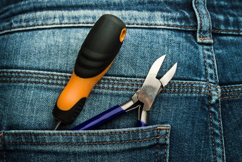 Tools on a pants pocket stock image. Image of instruments - 23964625