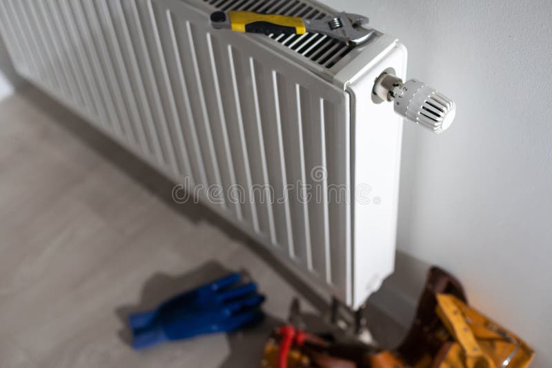 Tools on the radiator heat stock photo. Image of expert - 262007800