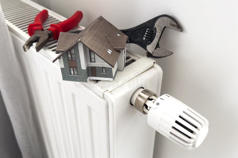 Tools on the Radiator. Water Heating Radiator on the White Wall Indoors ...