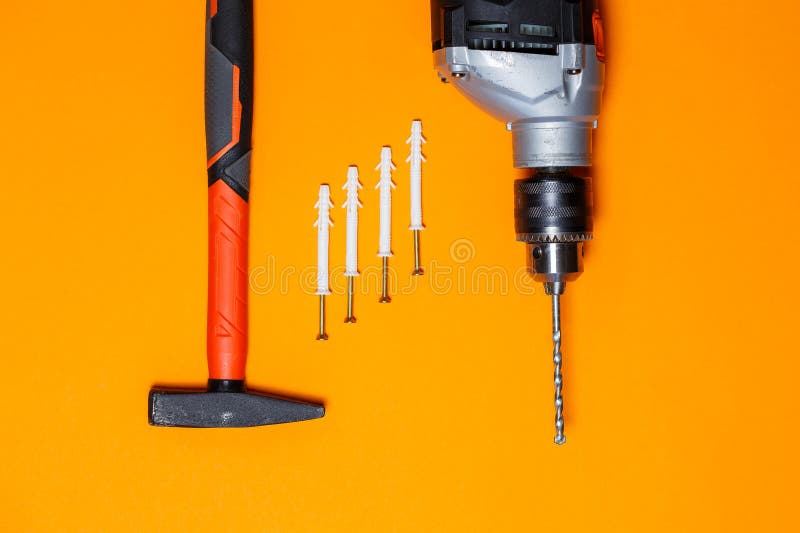 Tools for Repair. Hammer for Nails, Drill, Dowel in the Wall on an ...