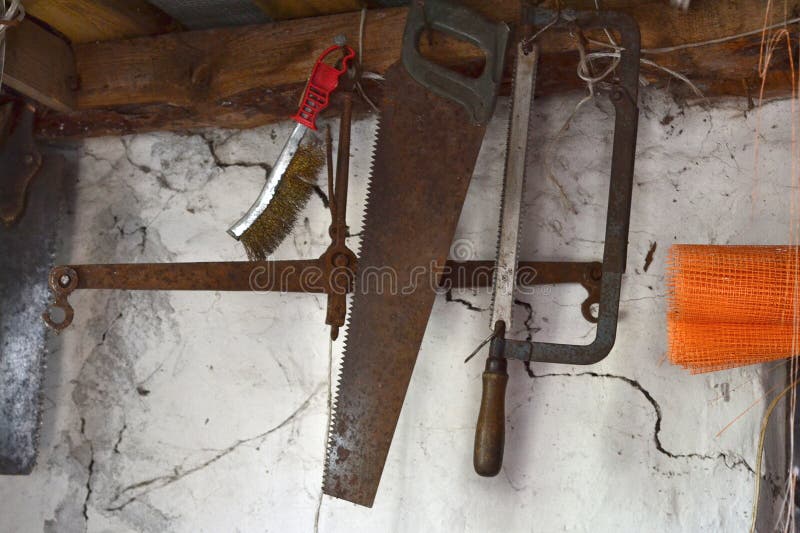 Tools, Saws, Brushes Hang on the Nails in the Cell Stock Photo - Image ...